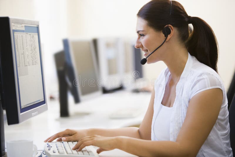Woman Wearing Headset in Computer Room Smiling Stock Image - Image of ...