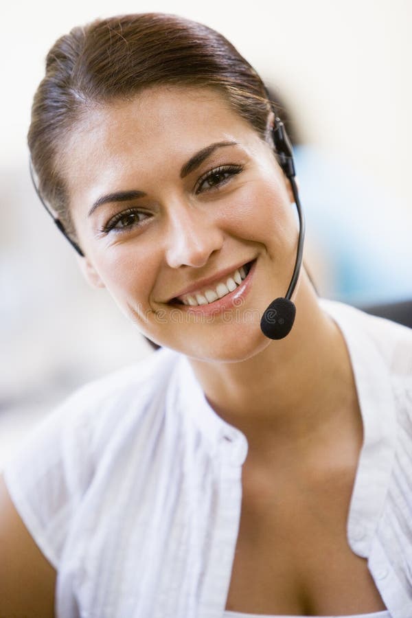 Woman Wearing Headset Indoors Smiling Stock Image - Image of helpful ...