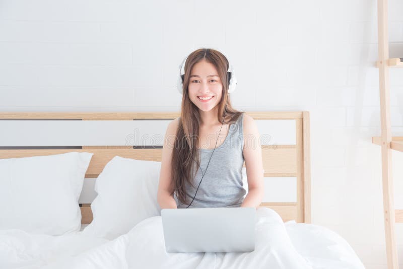 Woman Wearing Headset and Using Laptop Computer Stock Photo - Image of ...