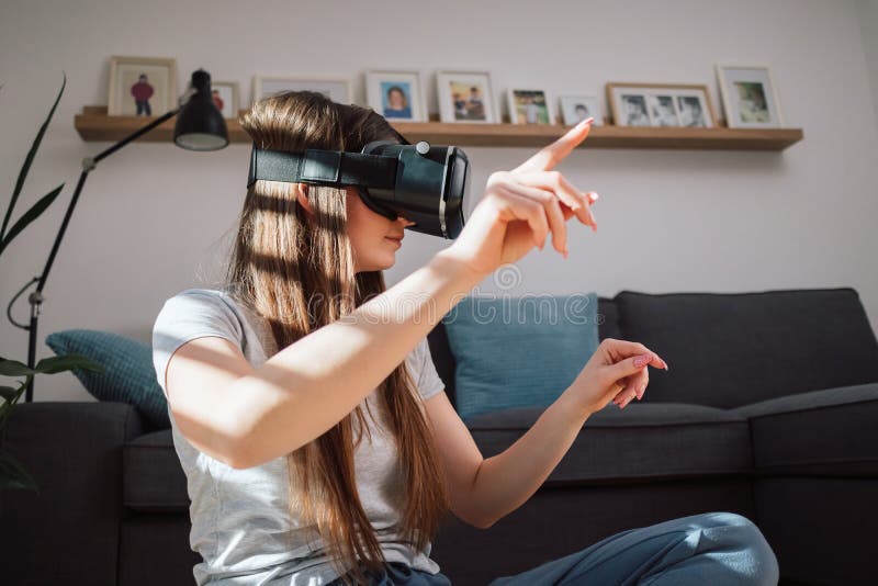 Woman Wearing Virtual Reality Glasses Exploring the Augmented World ... Woman Wearing Virtual Reality Glasses Exploring the Augmented World ...