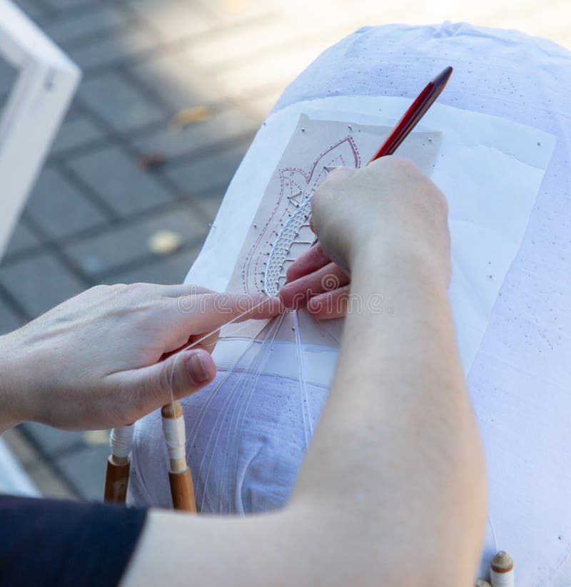 A Woman Weaves a Napkin with Patterns Using Threads Stock Image - Image ...