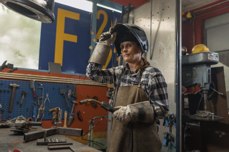 Woman in Welding Metal Workshop Stock Photo - Image of mask ...