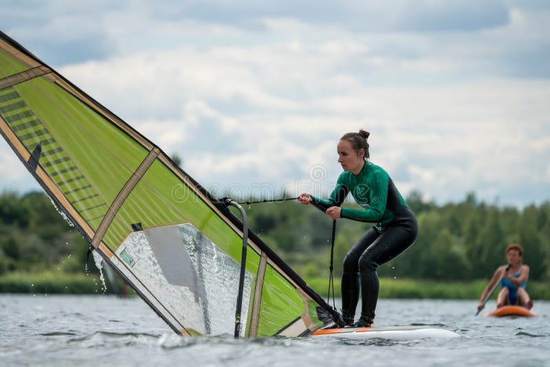 Woman Learning How To Windsurf Stock Image - Image of freedom, action ...