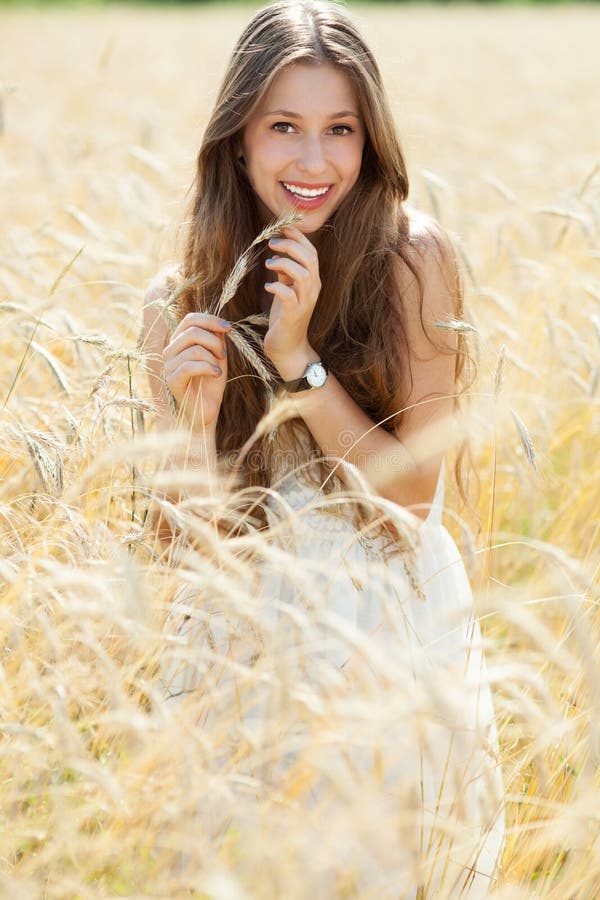 Woman in the wheat field stock image. Image of adult - 25780379