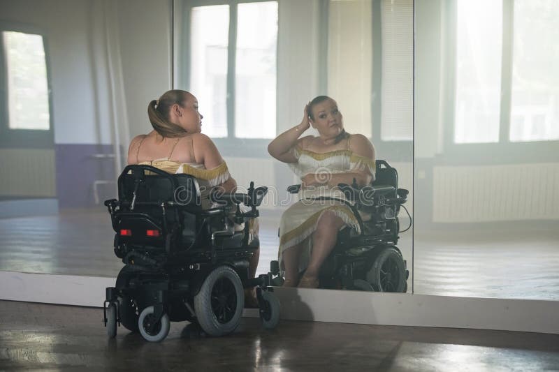 Woman, a Wheelchair Dancer Checking Her Look in a Mirror at a Dance ...