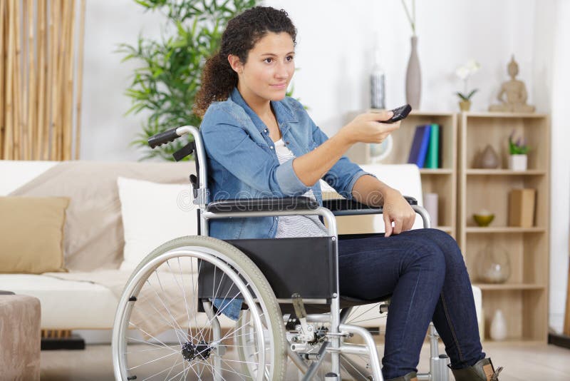 Woman in Wheelchair Using Remote Control Stock Image - Image of lady ...