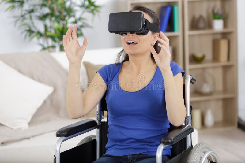 Woman in Wheelchair Using Virtual Reality Glasses at Modern Office ...