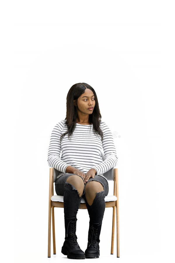 A Woman, on a White Background, in Full Height, Sitting on a Chair ...