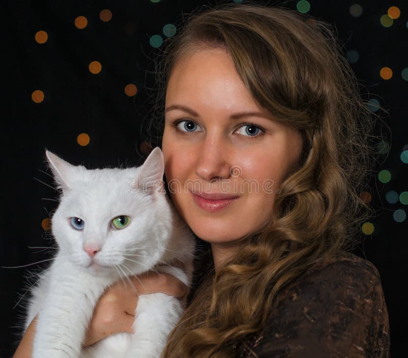 Woman and white cat stock photo. Image of handsome, bokeh - 34655340