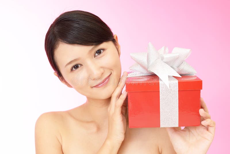 Smiling woman with a gift stock image. Image of enjoy - 131273717