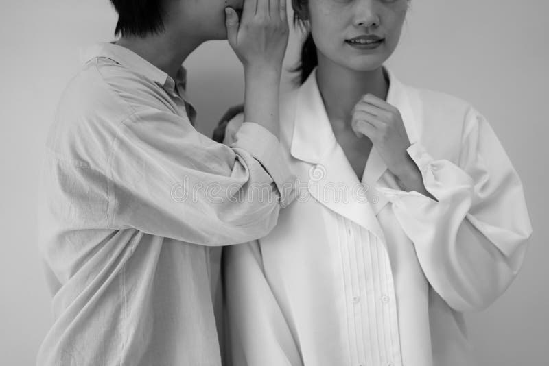 A woman who talks secretly stock image. Image of person - 232401021