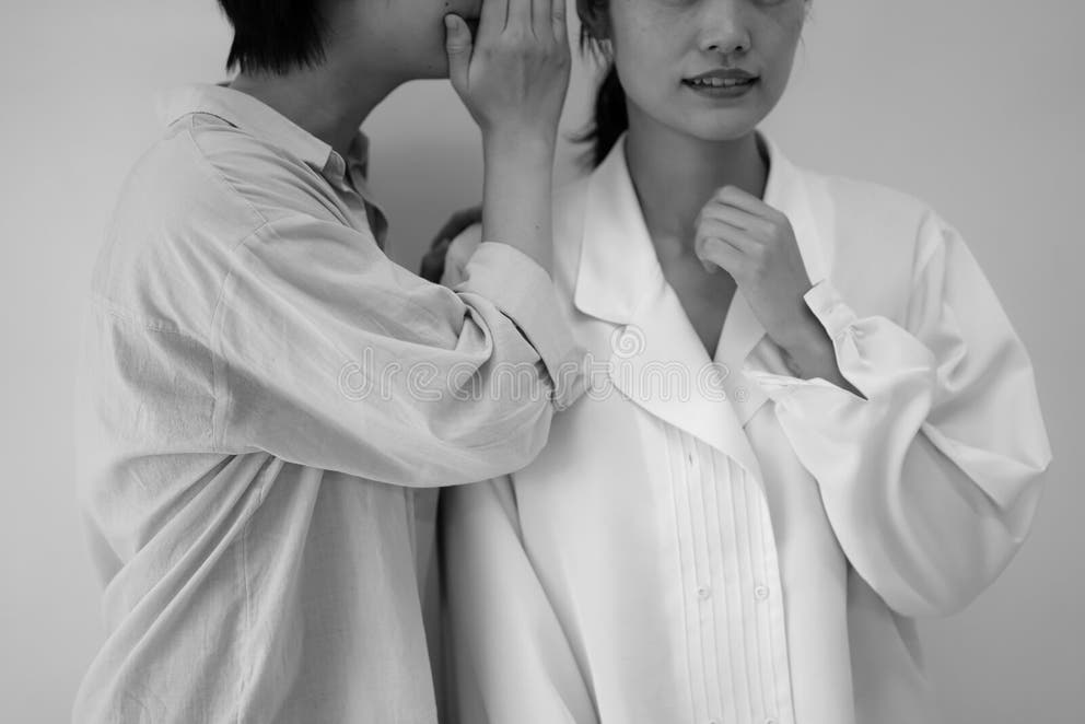 A woman who talks secretly stock image. Image of person - 232401021