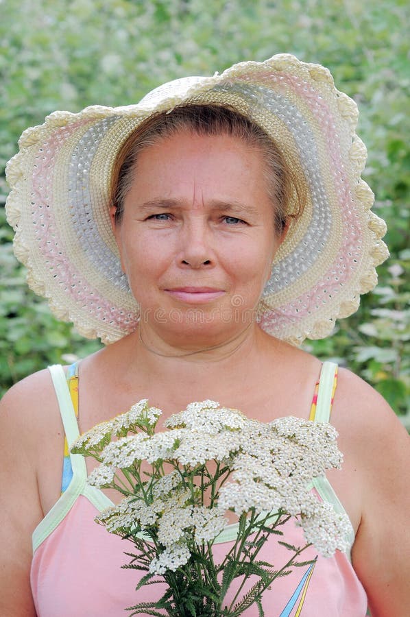 The Woman and Wild Flowers. Stock Photo - Image of plant, grass: 12936796