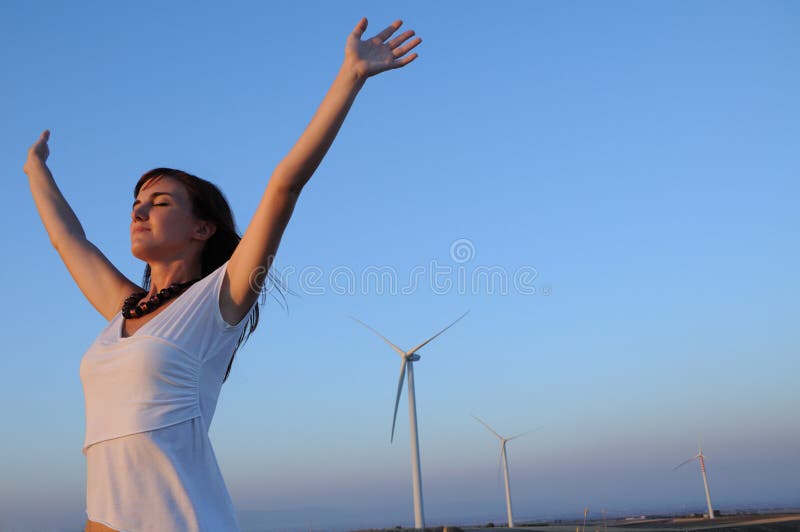 Woman and wind turbines stock photo. Image of peaceful - 6784920