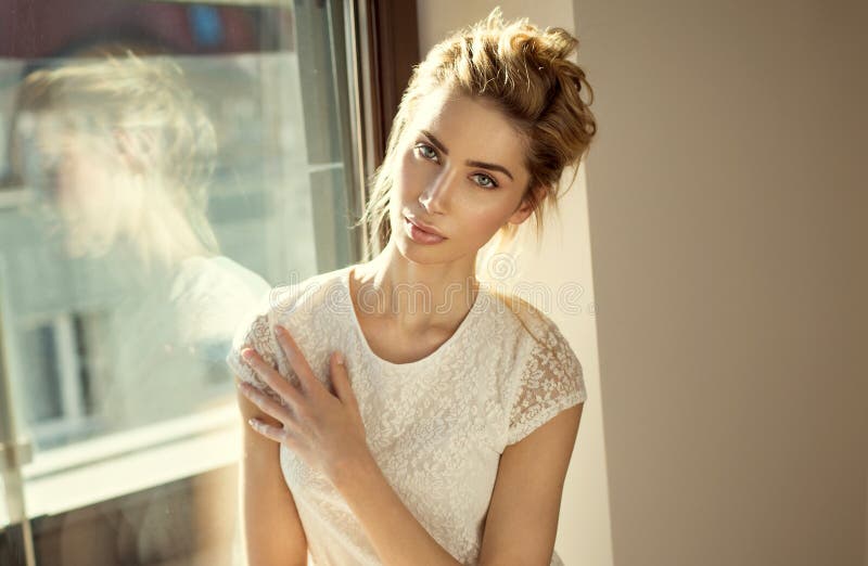 Woman on window stock image. Image of youth, expression - 40122365