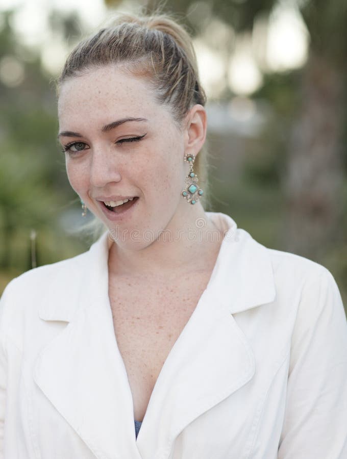 Woman Winking at the Camera Stock Photo - Image of style, daytime: 16848208