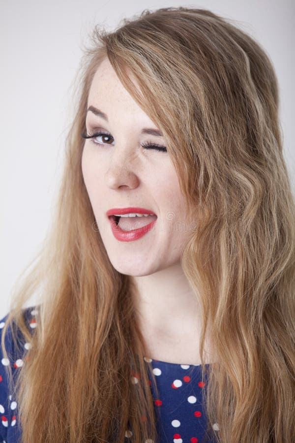 Woman winking with one eye stock photo. Image of fashionable - 25224974