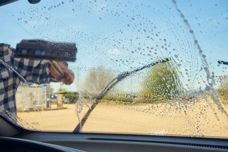 Woman Wiping Car Windshield with Squeegee Outdoors Stock Image - Image ...