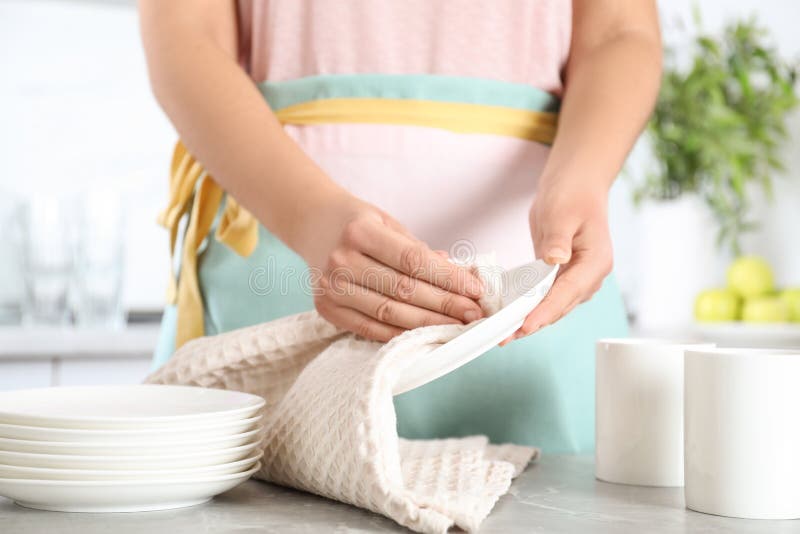 Woman Wiping Clean Plate at Table Stock Photo - Image of dinner, group ...