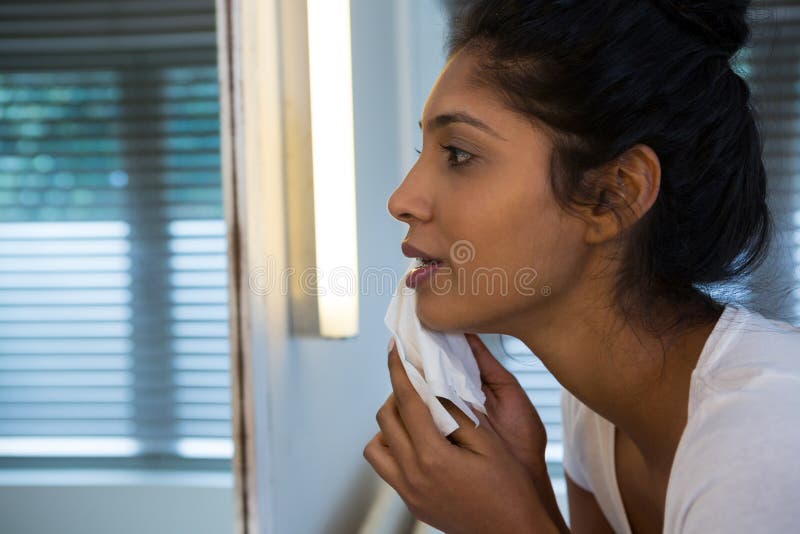 Woman Wiping Face in Bathroom Stock Photo - Image of life, hair: 97400564