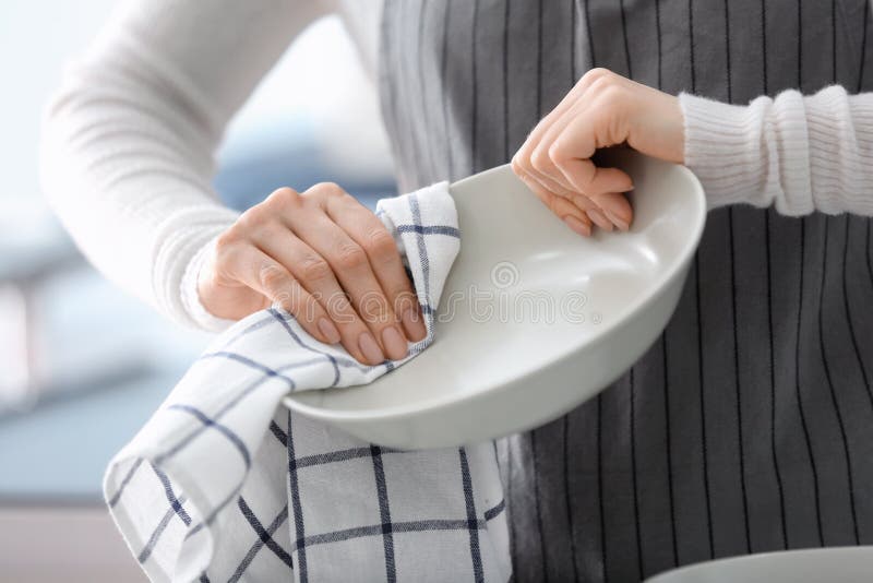 Woman Wiping Plate with Towel in Kitchen Stock Photo - Image of room ...