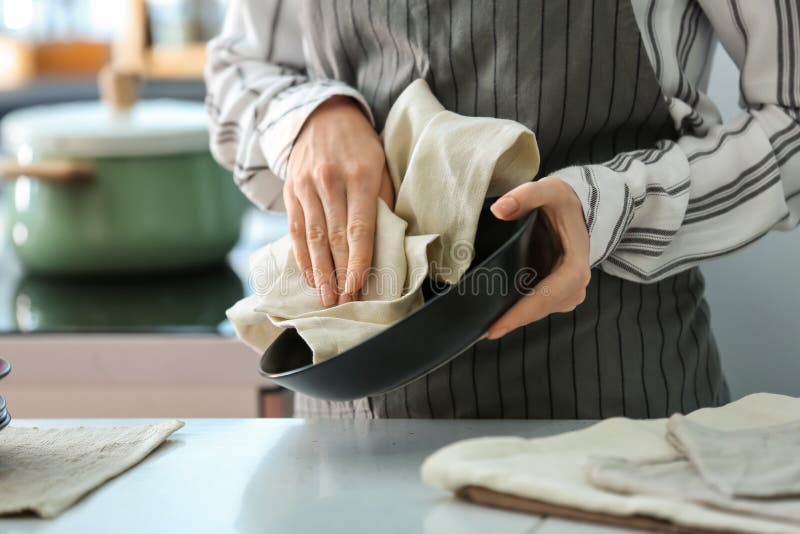 Woman Wiping Plate with Towel in Kitchen Stock Photo - Image of table ...