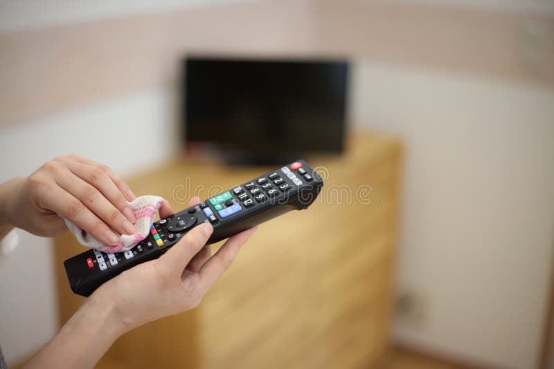 Woman Wiping the Remote Control Stock Image - Image of beautiful ...