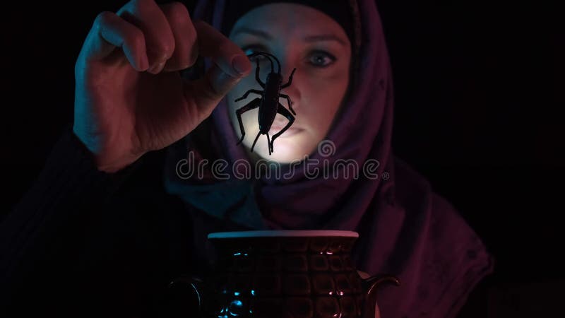 A Woman of a Witch in Black Clothes in a Forest is Tied with Chains To ...