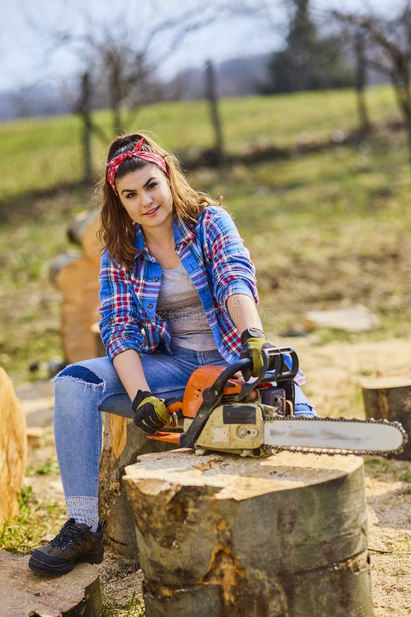 Woman Woodcutter Rests on a Log Stock Image - Image of outside, tool ...