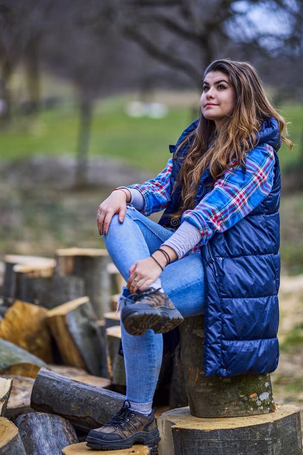 Woman Woodcutter Rests on a Log Stock Image - Image of smiling, wooden ...