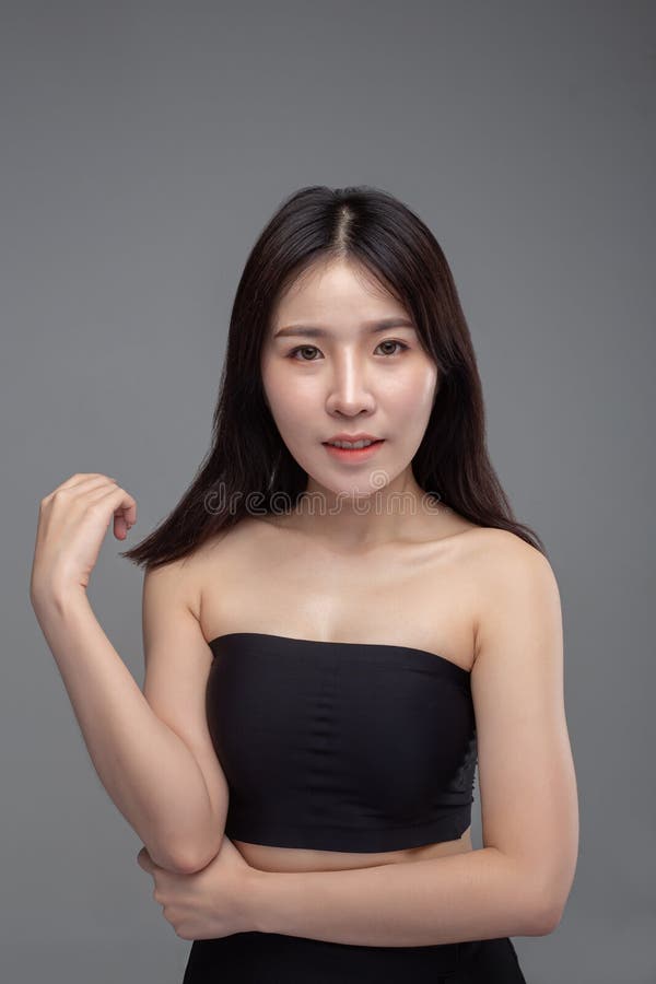 The Woman Wore a Black Strapless and Raised Her Right Hand Stock Photo ...