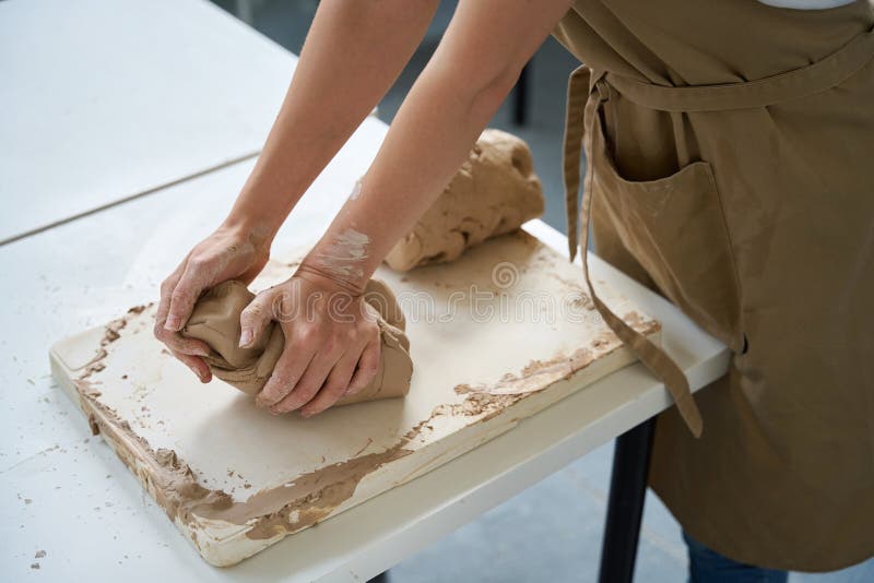 Woman Crumples a Piece of Clay on the Table Stock Image - Image of ...