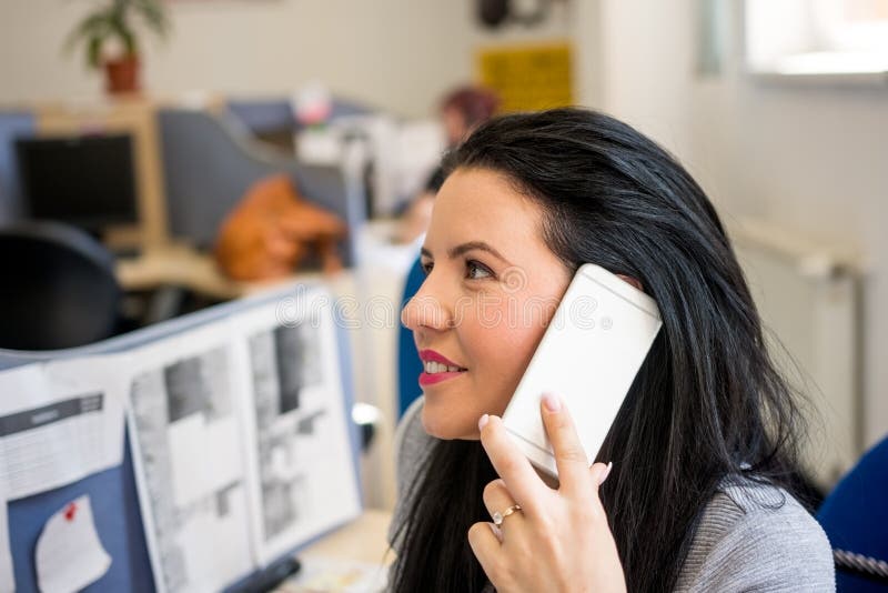 Woman at Work Gives To Customers Information Using Mobile Phone Stock ...