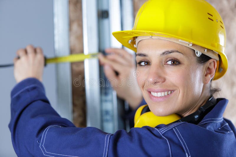 Woman Worker Measuring Dimensions on Plasterboard Panel Stock Image ...