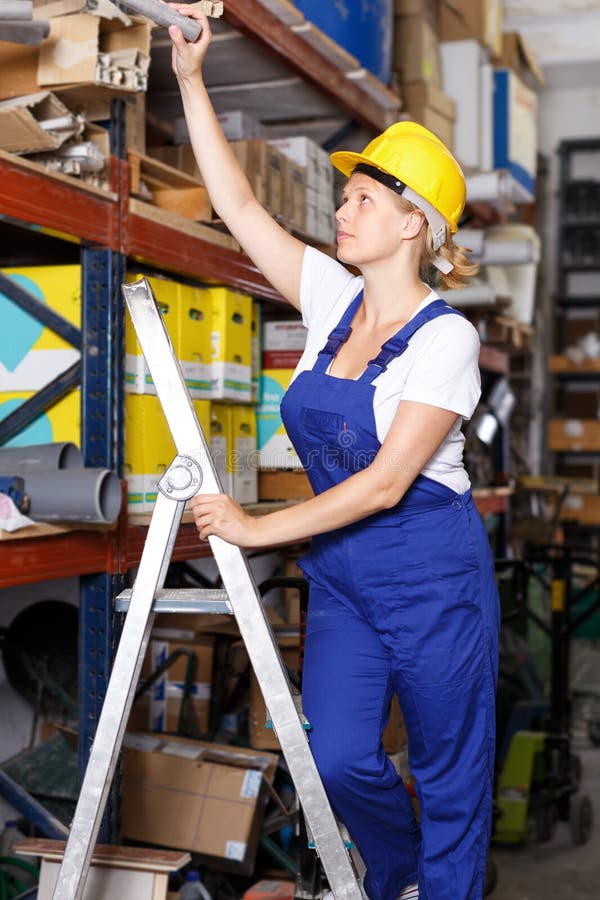 Woman Worker in Uniform Standing at Steps and Looking Construction ...