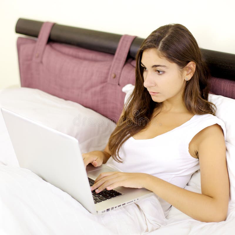 Woman Working in Bed with Computer Serious Stock Image - Image of ...