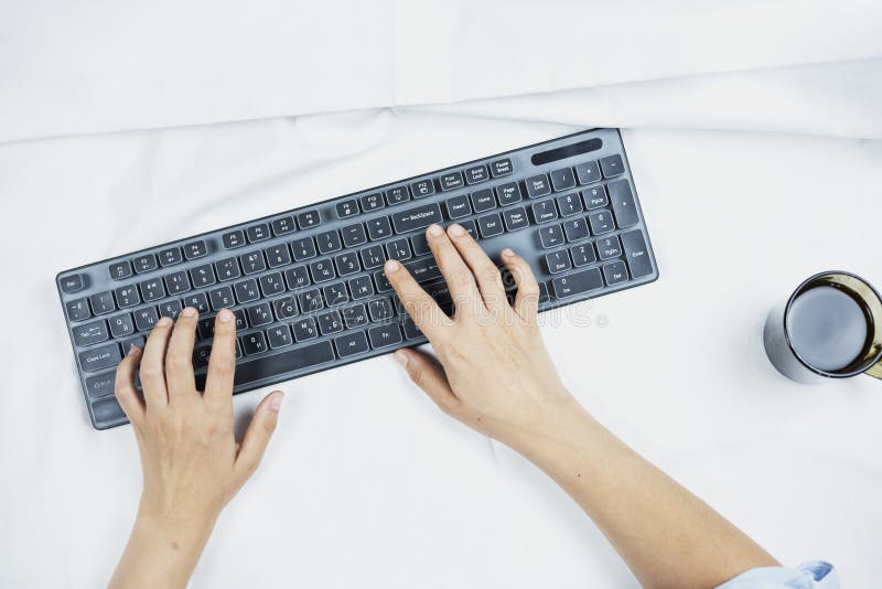 Woman Working in Bed. Working Remotely in Cozy Pure White Bed Stock ...