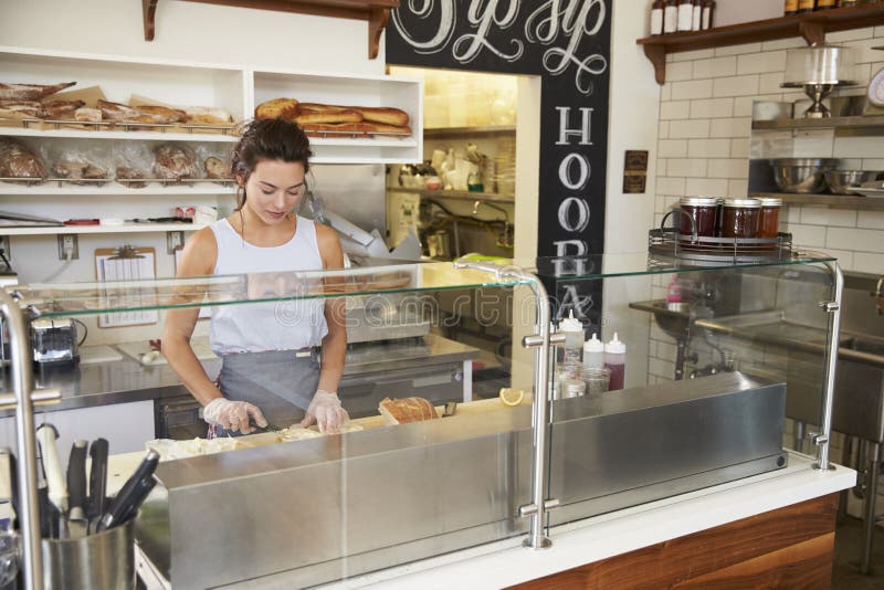Woman Working Behind the Counter at a Sandwich Bar Stock Photo - Image ...