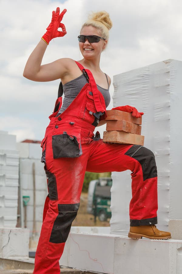 Woman working with bricks stock image. Image of housing - 150249889