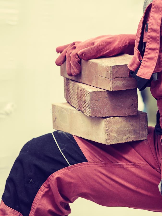 Woman working with bricks stock photo. Image of person - 198624376