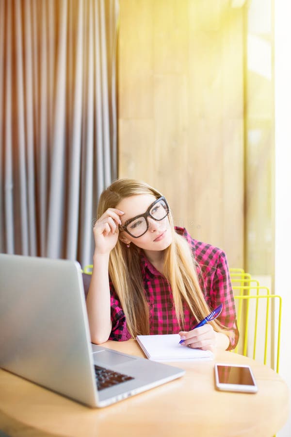 Woman Working on a Computer at a Cafe. Tired Face of Woman. Stock Photo ...