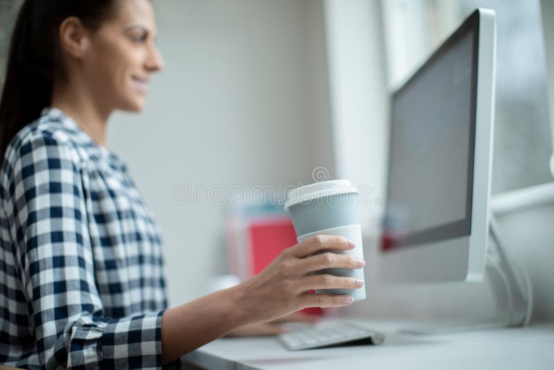 Woman Working at Computer Drinking from Reusable Takeaway Cup Stock ...