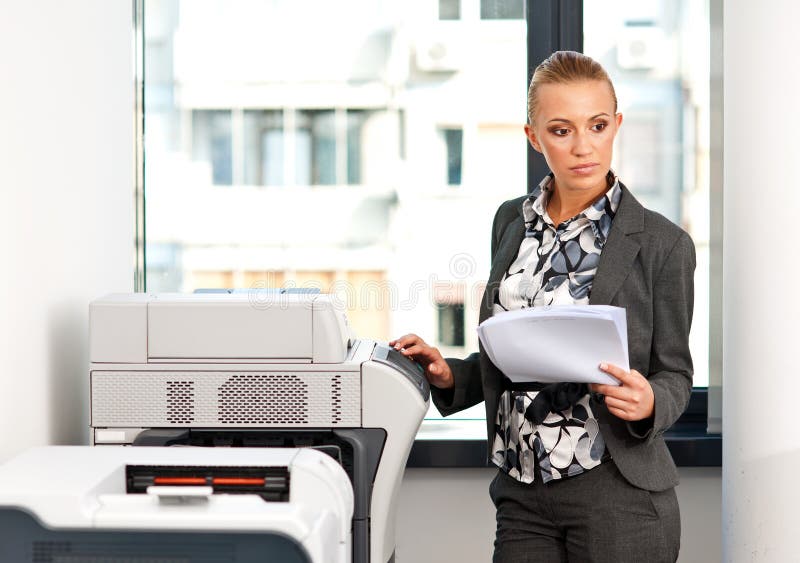 Woman Working on Copy Machine Stock Photo - Image of communication ...