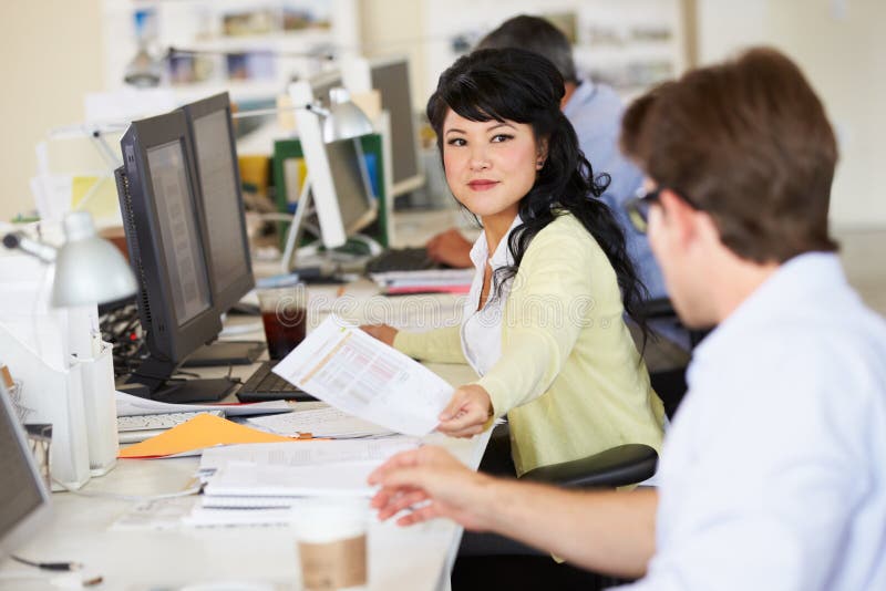Woman Working at Desk in Busy Creative Office Stock Image - Image of ...