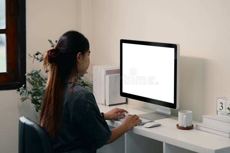 Woman Working at a Desktop Computer with Blank Screen in Clean, Modern ...