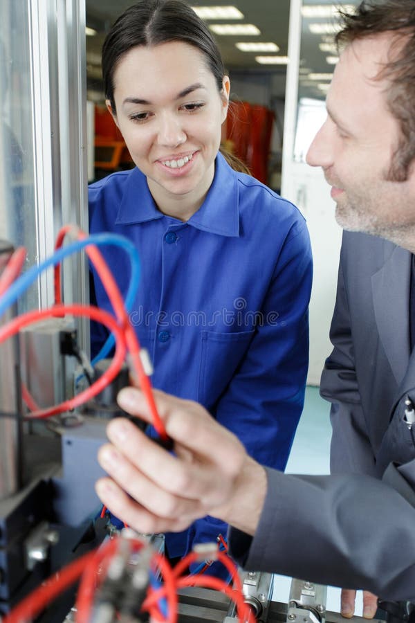 Woman Working on Electronic Device with Teacher Stock Photo - Image of ...