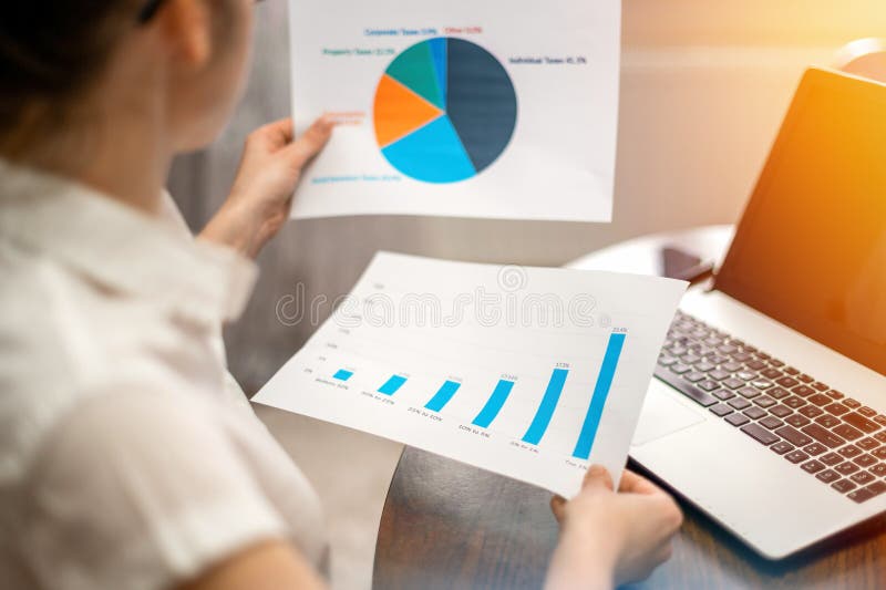 Woman Working with Finance Diagrams on the Table Stock Image - Image of ...