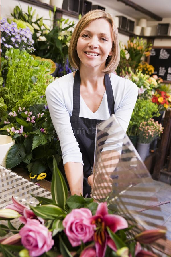 Woman Working at Flower Shop Smiling Stock Image - Image of counter ...