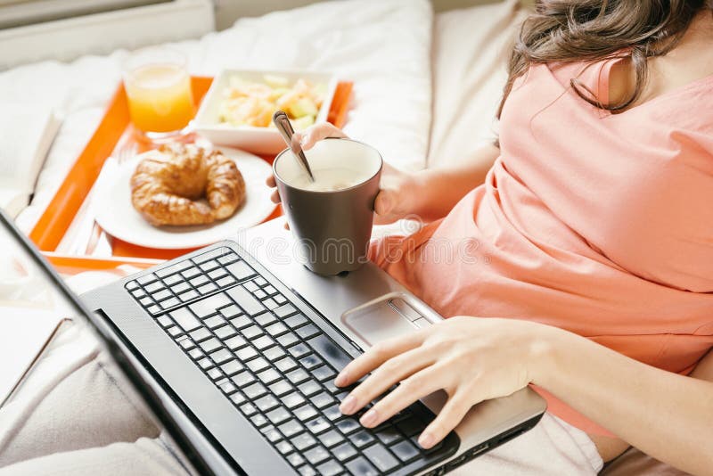 Woman Working with Her Laptop Computer and Having Breakfast Stock Photo ...