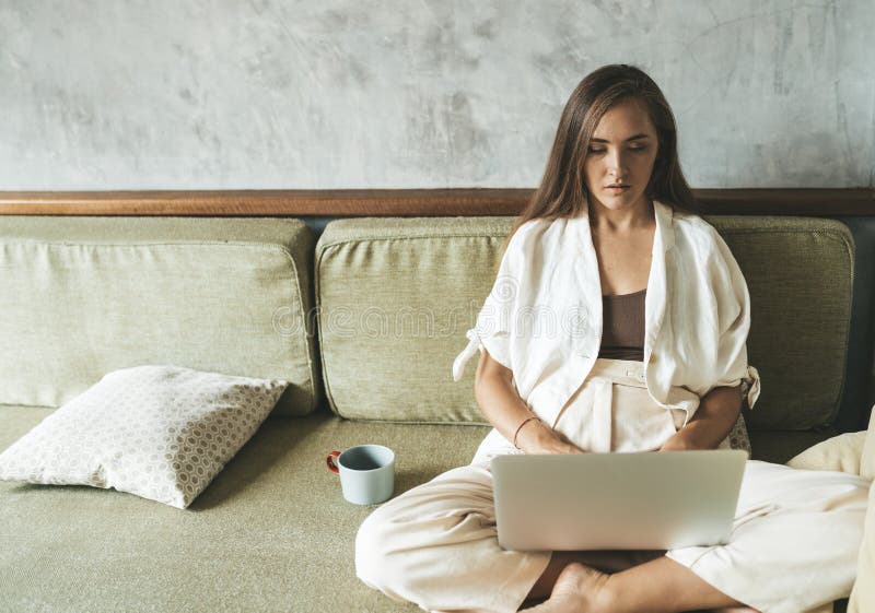 Woman Working from Home at the Computer on the Sofa Stock Photo - Image ...